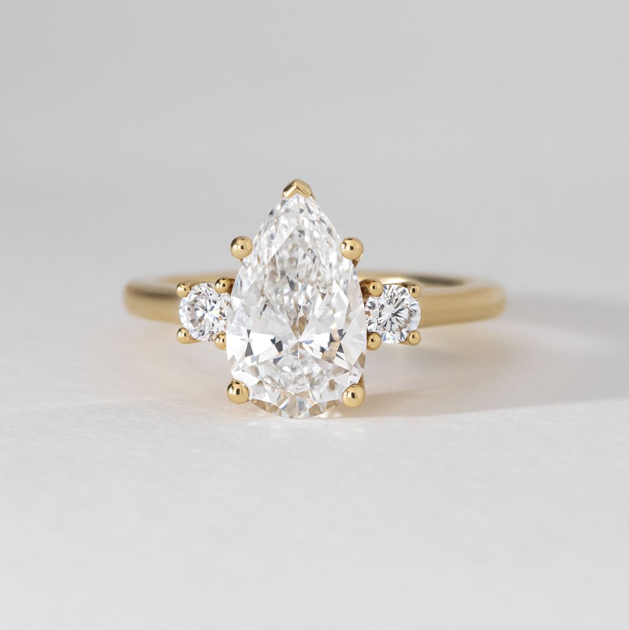2.50 Carat Lab Grown Pear Diamond Trilogy Engagement Ring in Yellow ...